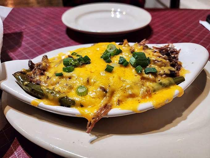 Melted cheese blankets roasted chiles in a dish that proves sometimes the simplest combinations create the most memorable flavors.