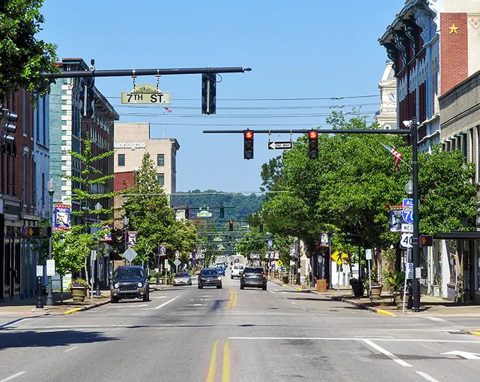 Main Street stretches toward the horizon, its tree-lined sidewalks and historic buildings creating the kind of downtown that Norman Rockwell would have painted while eating ice cream.