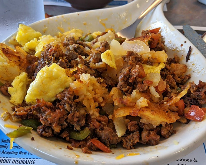 A hearty skillet where eggs, potatoes, and seasoned ground beef create a morning fiesta. Breakfast with attitude and a kick of spice.