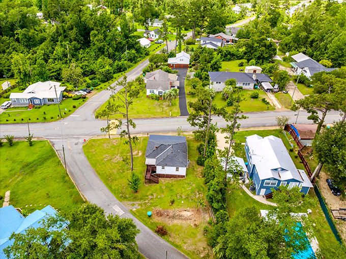 From above, Chattahoochee reveals its true character &ndash; modest homes nestled among towering trees, where nature and neighborhood exist in perfect balance.