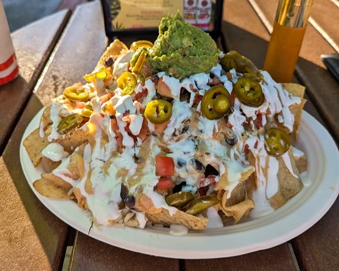 Nachos that require a strategy to eat&mdash;every chip a potential treasure chest of toppings. That guacamole crown deserves its own royal title.