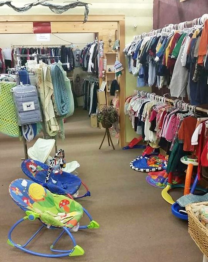 The children's section, where tiny clothes and baby equipment await new little ones. Those bouncy seats have already soothed countless fussy afternoons.