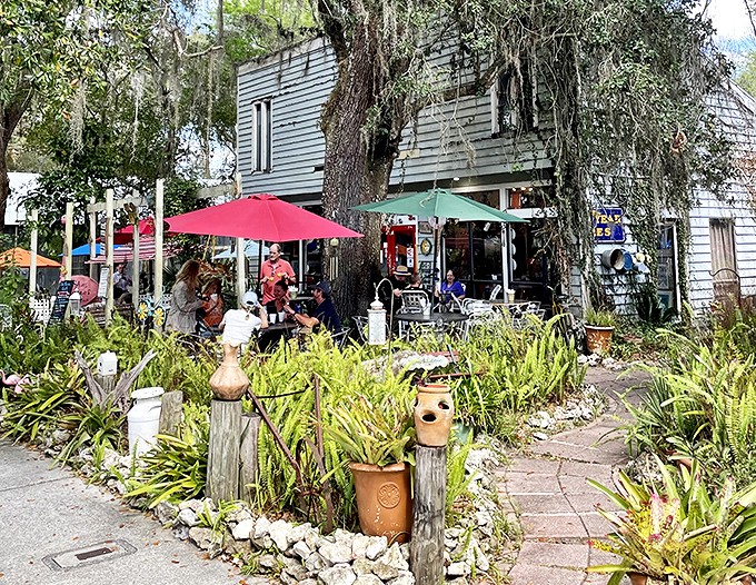 Old Florida Cafe's garden seating turns lunch into a botanical adventure, where colorful umbrellas compete with native plants for your attention. 