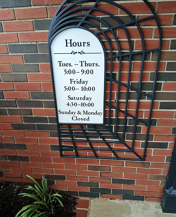 The hours posted clearly on brick&mdash;because when you serve food this good, people need to know exactly when they can get it.