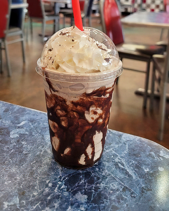 This Oreo shake isn't just a dessert, it's a commitment—a glorious mountain of ice cream and cookies that demands both a spoon and straw.