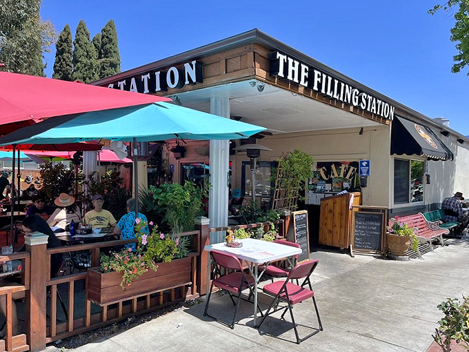 Morning sunshine bathes the cafe's exterior while diners claim their spots&mdash;early birds getting the ultimate breakfast worm.