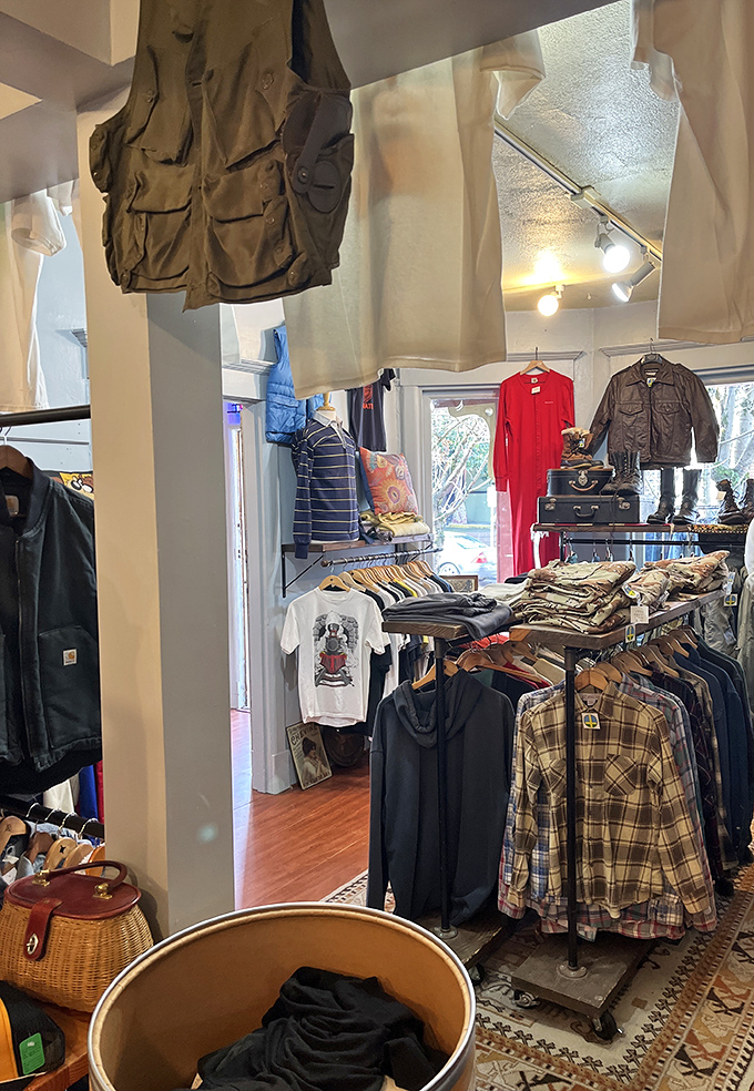 Fishing vests and flannel shirts stand at attention like Pacific Northwest sentinels, ready to protect you from both rain and fashion mediocrity.