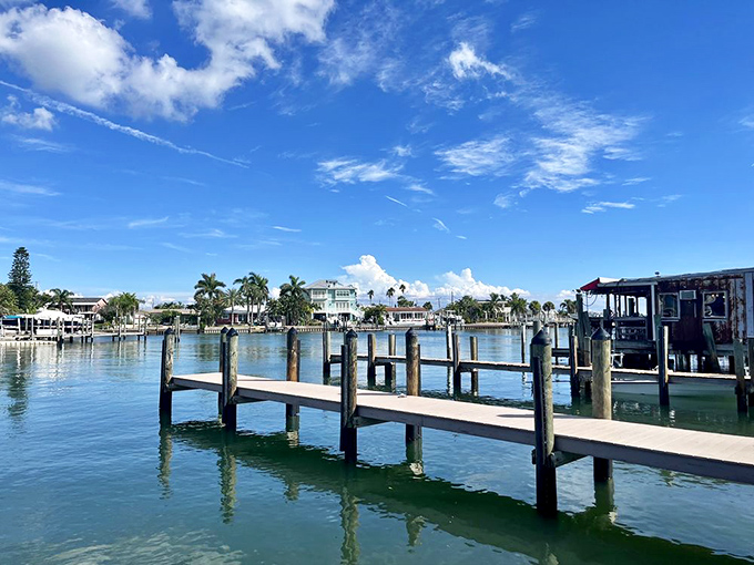 The dock stretches into pristine waters, offering diners genuine waterfront views that money simply cannot manufacture anywhere else.