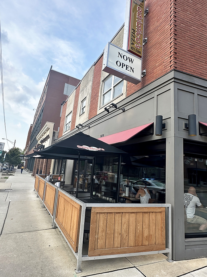 Outdoor seating that transforms sidewalk dining into an urban pizza picnic &ndash; fresh air somehow makes the cheese taste even better.