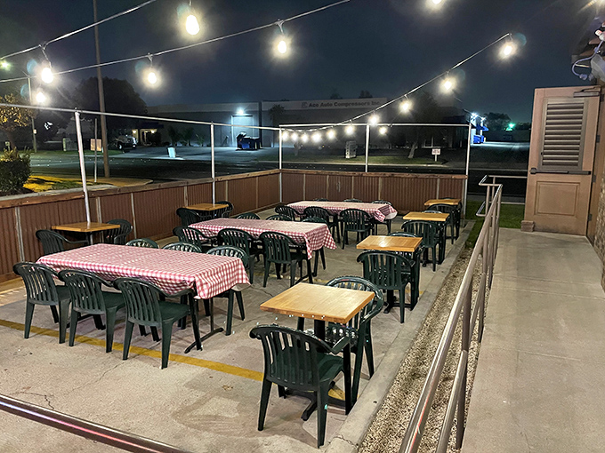 Outdoor seating under string lights &ndash; because BBQ tastes even better with a side of fresh air and California evening breezes.