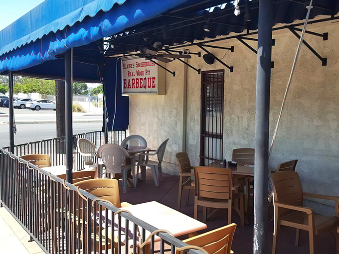 Outdoor seating under the blue awning offers fresh air with your fresh coffee. California dining at its most unpretentious and welcoming. 