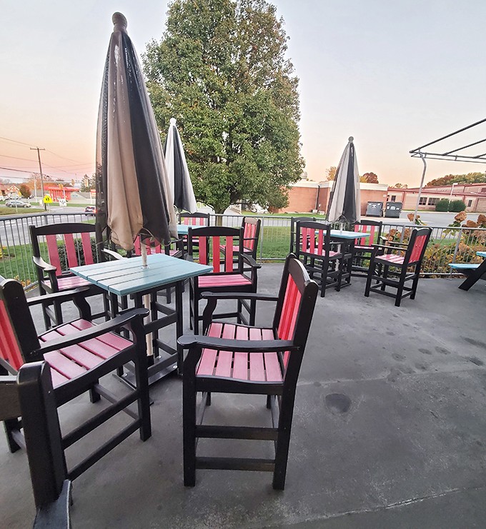 The outdoor seating area offers a more contemporary vibe with its pink and black furniture, perfect for enjoying those legendary shakes as the sun sets.
