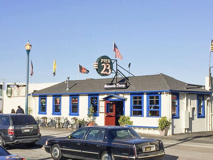 Pier 23's welcoming exterior where locals gather and visitors become converts to exceptional waterfront dining.