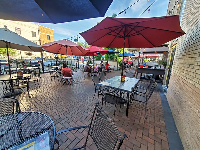The outdoor patio offers a perfect perch for people-watching on Delmar Boulevard, with colorful umbrellas providing shade for your al fresco feast.