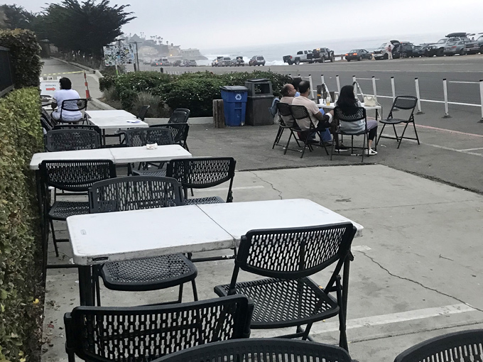 Outdoor seating with ocean views &ndash; because fresh air makes everything taste better, especially when paired with sea breeze.