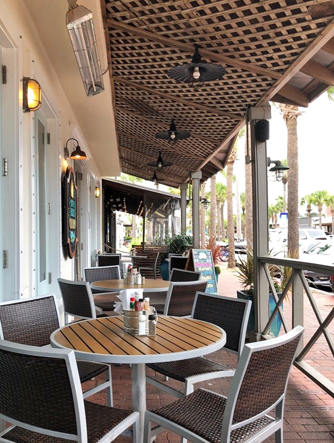 Outdoor seating that captures the essence of Florida dining&mdash;palm trees, sea breeze, and the promise of something delicious just moments away. 