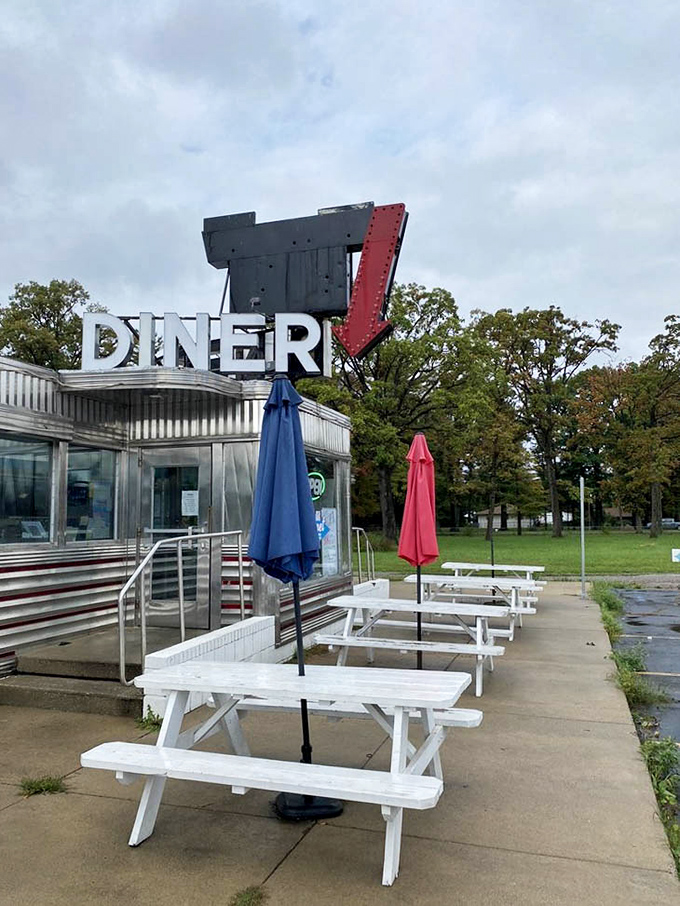 White picnic tables standing at attention, ready for duty. Al fresco dining Michigan-style means enjoying every non-winter moment like it's your last.