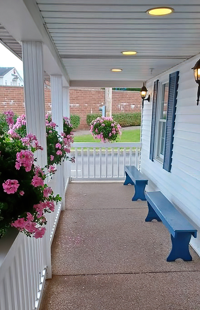 The porch's blue benches invite you to sit a spell, as Grandma would say&mdash;either before your meal (ambitious) or after (necessary).
