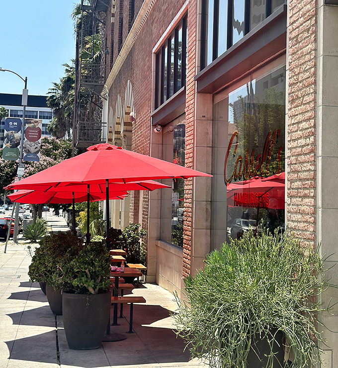 Red umbrellas and sidewalk seating invite you to enjoy Los Angeles weather while simultaneously enjoying one of its culinary treasures.