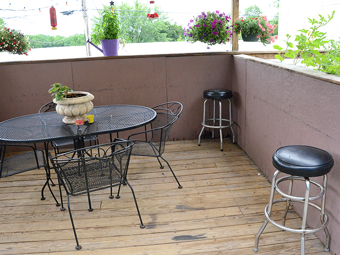 This simple outdoor seating area becomes prime real estate during warm Illinois evenings, when sunset views pair perfectly with cold drinks.