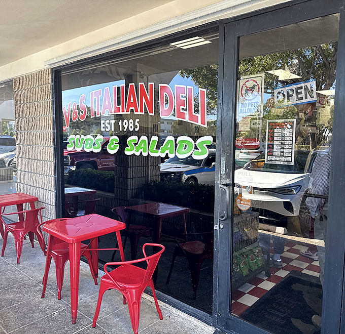 Those cheerful red tables outside aren't just furniture&mdash;they're front-row seats to the simple pleasure of enjoying a perfect sandwich under Florida skies.