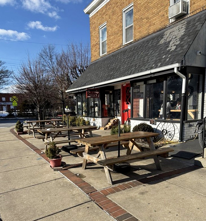 Outdoor picnic tables invite lingering conversations and the making of new friends, united by the universal language of exceptional barbecue.