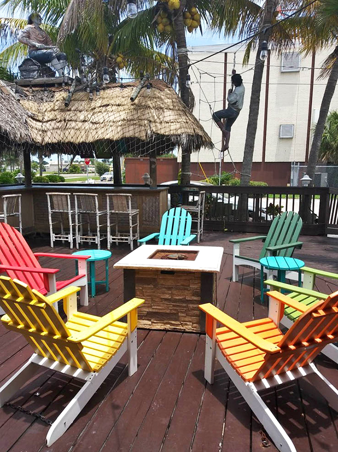 Adirondack chairs in colors brighter than your future after winning the lottery &ndash; outdoor seating designed for post-seafood contentment.