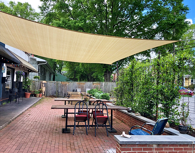 The outdoor patio offers a breath of fresh air under a sail-like canopy. Perfect for those North Carolina evenings when the weather is showing off.