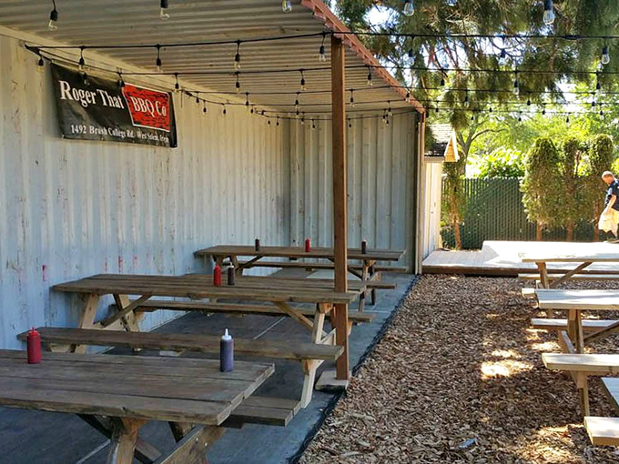 The covered outdoor area offers a rustic dining experience where the only thing better than the fresh air is the aroma of smoked meat that permeates it.