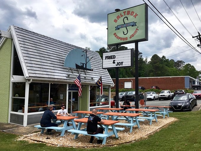 Outdoor picnic tables invite lingering conversations and second helpings, where "just one more hush puppy" becomes everyone's mantra.