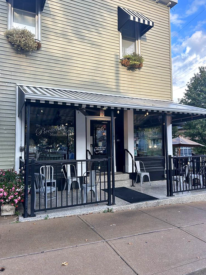 Flower boxes and striped awnings frame an entrance that promises good times and even better fried chicken.