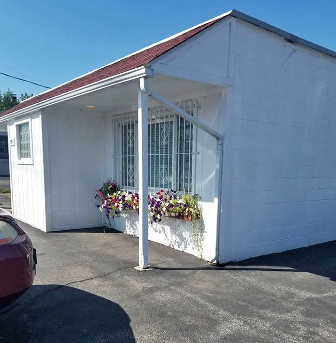 Even the exterior gets a touch of charm with flower boxes brightening the simple white building&mdash;a hint at the warmth waiting inside.