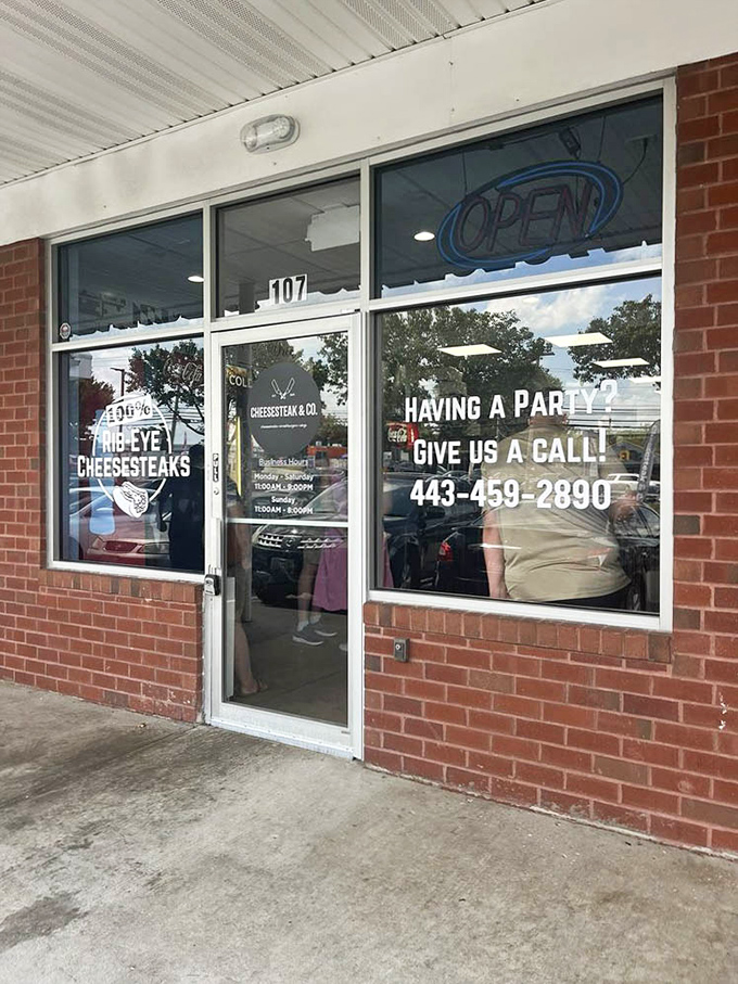 "Having a party? Give us a call!" promises the window sign&mdash;because nothing says celebration like a platter of Maryland's finest cheesesteaks.