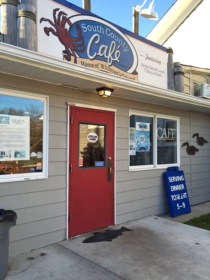 The welcoming entrance with its cheerful red door and dinner hours sign stands as a beacon for hungry travelers seeking authentic Chesapeake flavors.