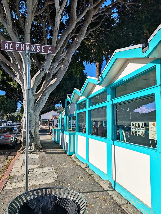 The corner of Alphonse Street and Culinary Paradise. That distinctive turquoise trim has guided hungry pilgrims for generations.