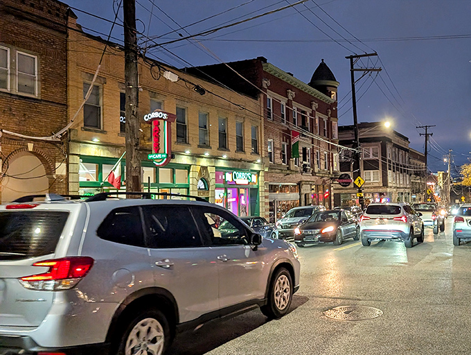 As evening falls on Little Italy, Corbo's glowing sign becomes a beacon of sweetness on Mayfield Road, guiding dessert pilgrims home.