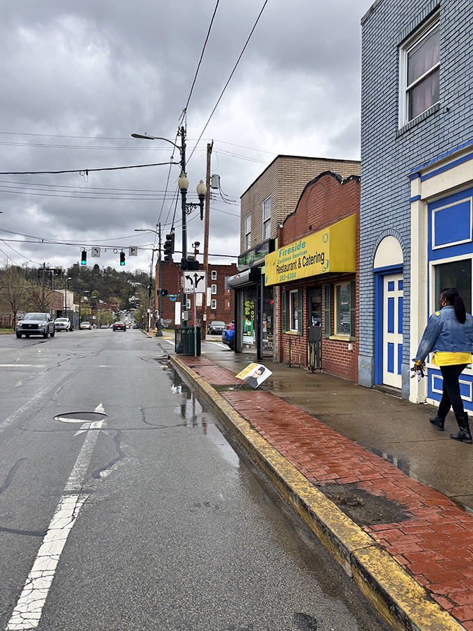 Even on a gray Pittsburgh day, Fireside's yellow sign stands as a beacon of Caribbean warmth on Penn Avenue's busy thoroughfare.