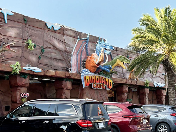The exterior sign features a colorful dinosaur trio that seems to say, "Yes, we're exactly as fun as we look. Come hungry!"