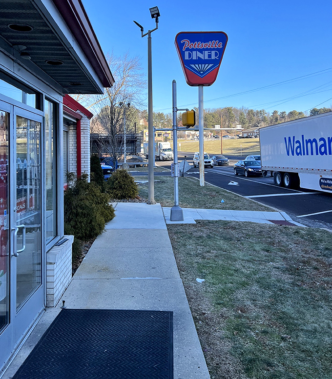 That classic sign stands like a beacon of hope for the hungry, promising salvation in the form of perfectly cooked comfort food just steps away.