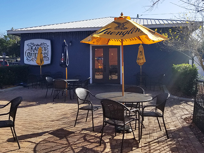 The outdoor seating area, complete with cheerful yellow umbrellas, offers al fresco dining when Florida's weather decides to cooperate.