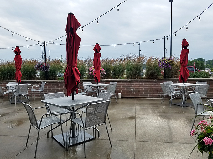 The patio offers al fresco dining with string lights creating instant ambiance. Where summer evenings stretch longer and food somehow tastes even better.