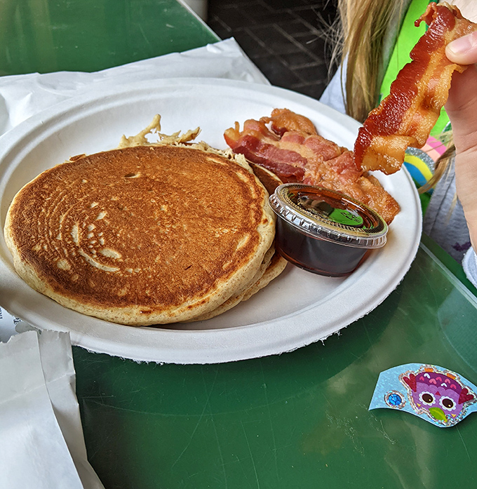 Golden pancake perfection with a side of bacon&mdash;the breakfast equivalent of a standing ovation, simple yet somehow revolutionary.