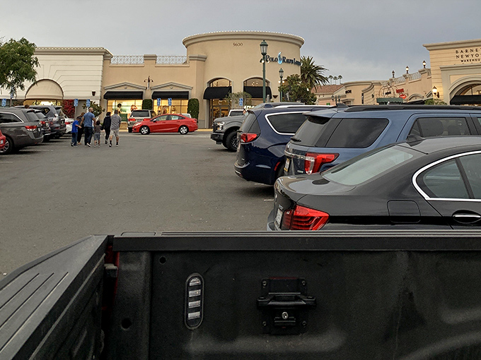 The parking lot at dusk&mdash;where shoppers return, bags in hand, wallets lighter, but spirits lifted by the thrill of scoring incredible deals.