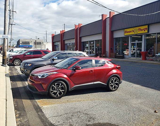 The exterior view reveals Sloan's prime Bristol location. Full parking lot – always the sign of a thrift store worth investigating.