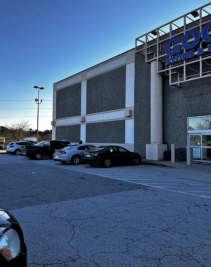 The parking lot: first stop on your journey to secondhand nirvana. Each car represents another savvy shopper joining the sustainable fashion revolution.