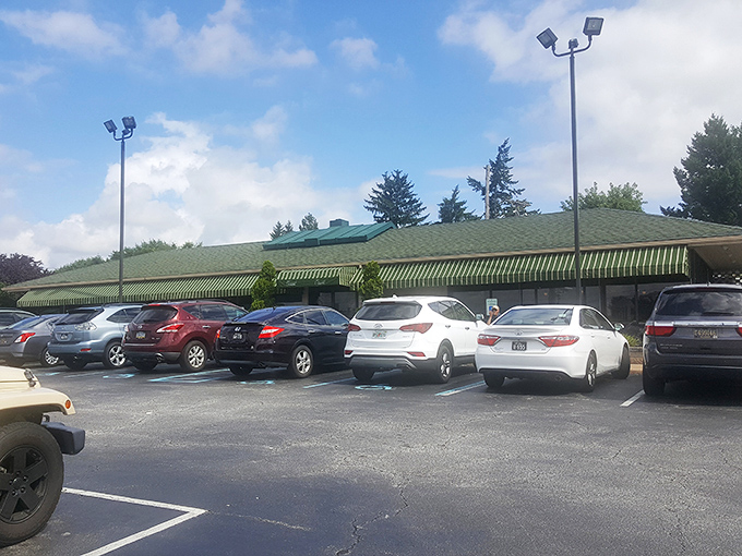 The green-roofed building stands like a culinary lighthouse, guiding hungry travelers to a safe harbor of deliciousness.