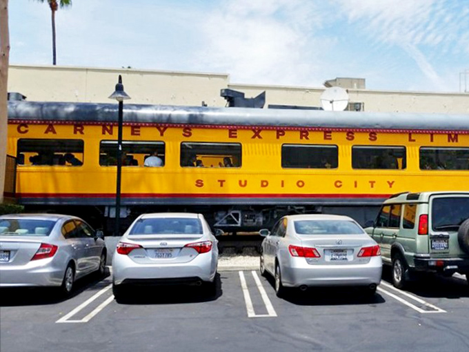 Even from the parking lot, that yellow train car beckons like a culinary lighthouse, guiding hungry souls to burger salvation amid the sea of Studio City traffic.