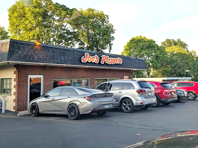 A packed parking lot tells the real story&mdash;when locals line up their cars outside a pizza joint, you know you've found the good stuff.