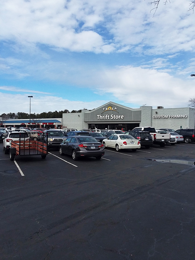A packed parking lot&mdash;the universal sign of "get in here, the bargains are going fast!" that creates a pavlovian response in seasoned thrifters. 