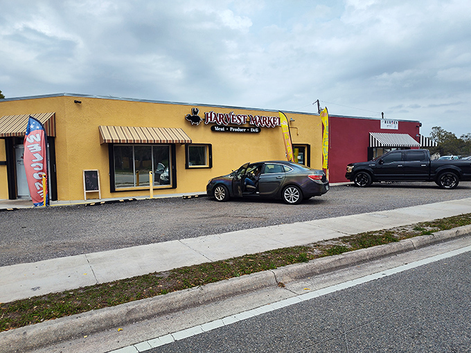 The Heroes Grill stands proudly alongside neighboring businesses, a culinary beacon for those in-the-know on Titusville's dining landscape.